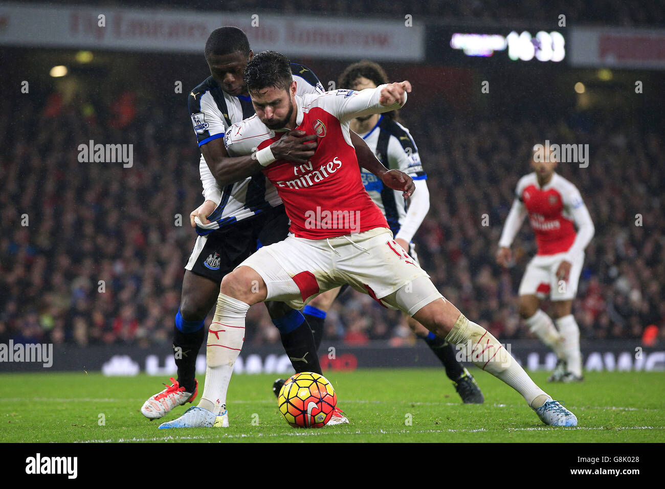 Arsenal's Olivier Giroud and Newcastle United's Chancel Mbemba (left ...
