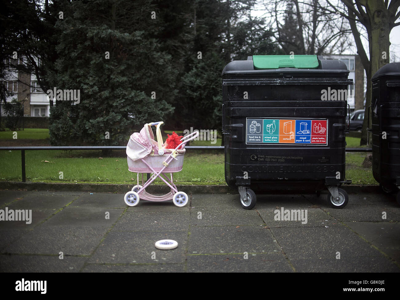 A discarded toy pram is seen on a housing estate in London Stock Photo ...