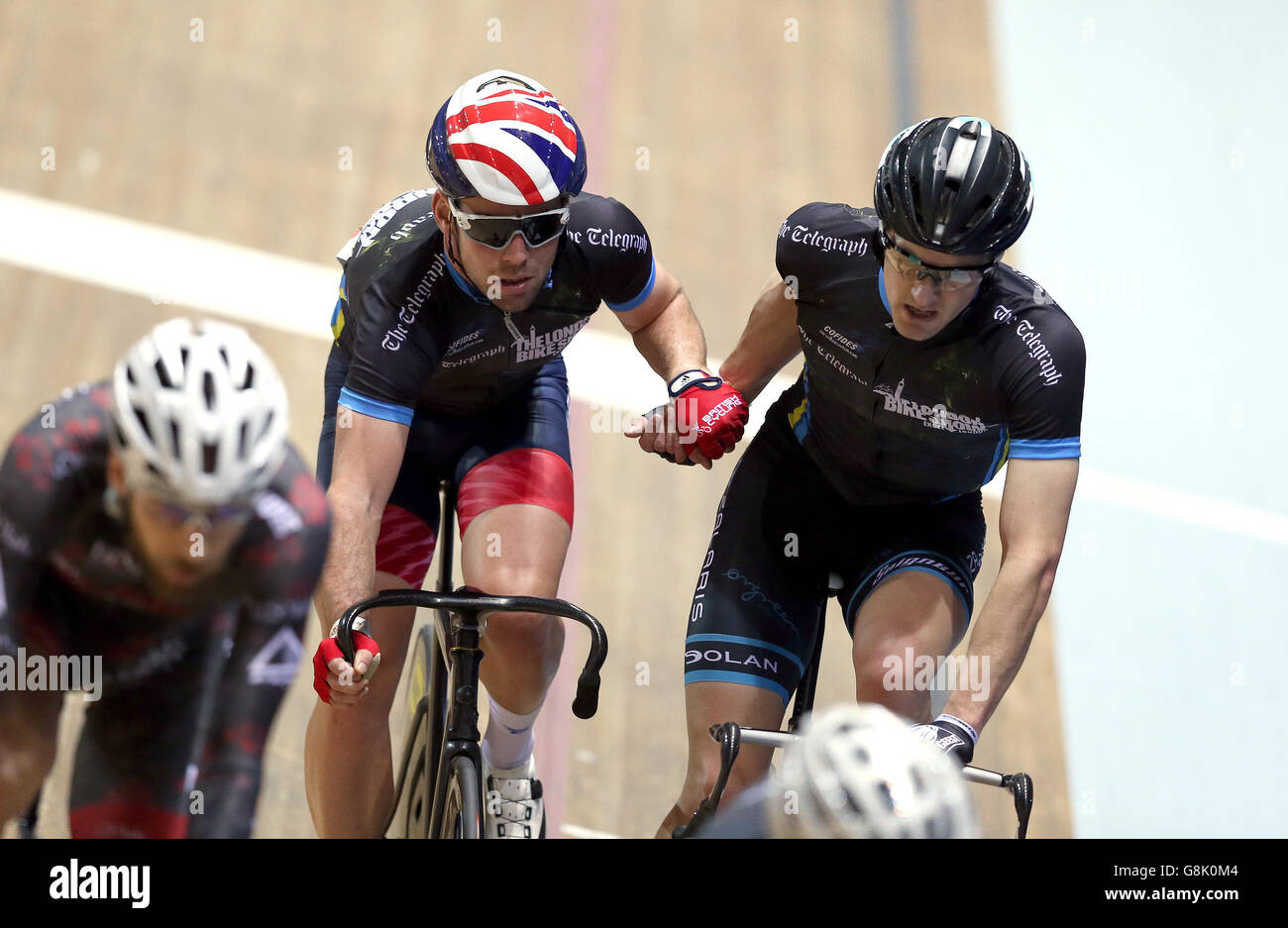 Mark Cavendish changes with team mate Marc Hester (right) during the ...