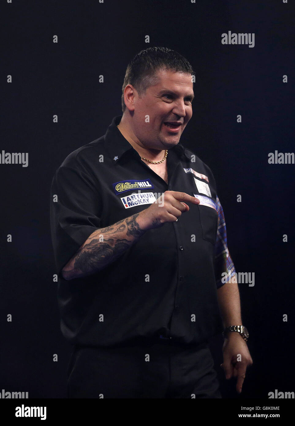 Gary Anderson celebrates after hitting a 9 darter during the semi final ...