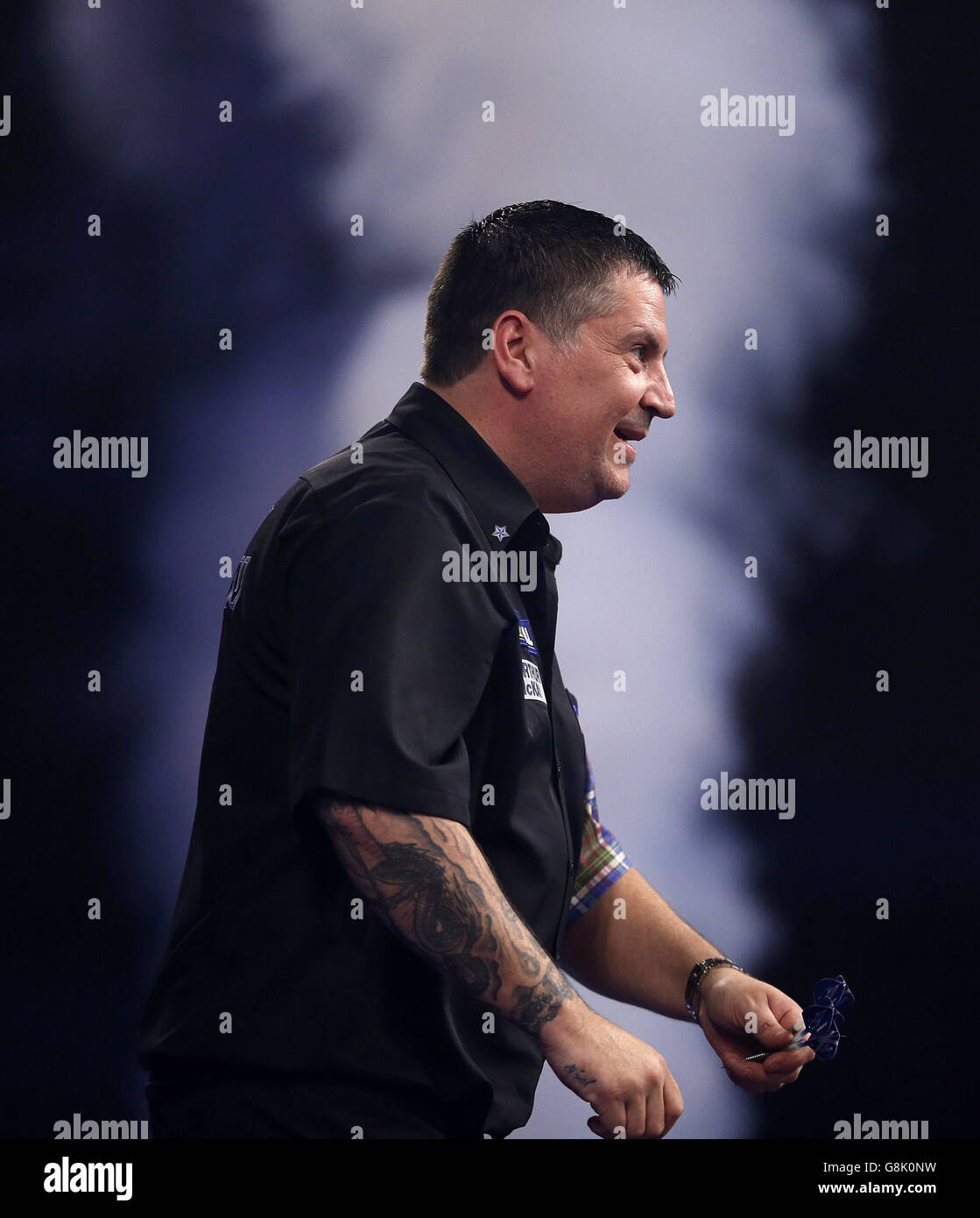 Gary Anderson celebrates after winning his semi final match during day ...