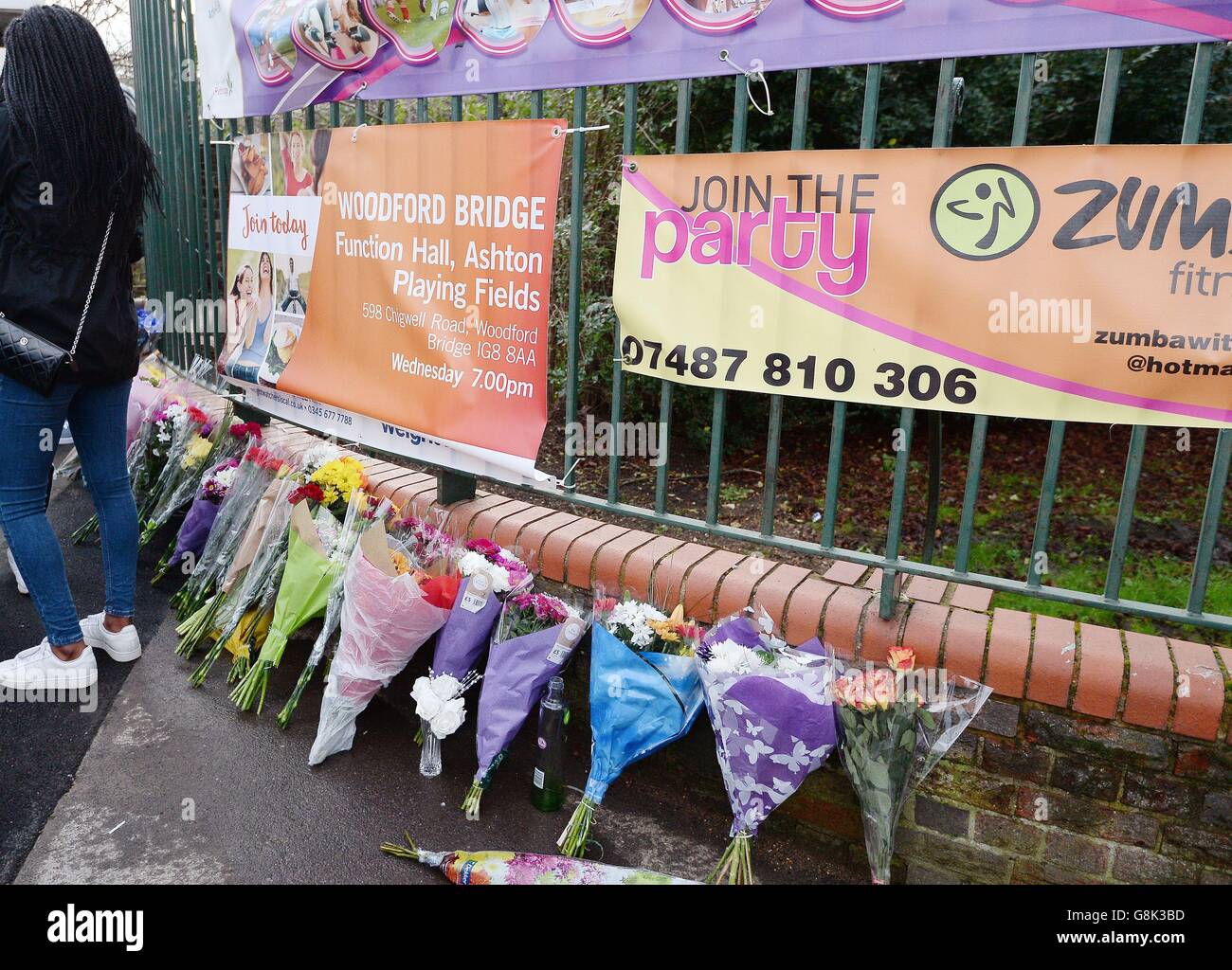 People lay flowers near the entrance of Ashton playing fields where a ...