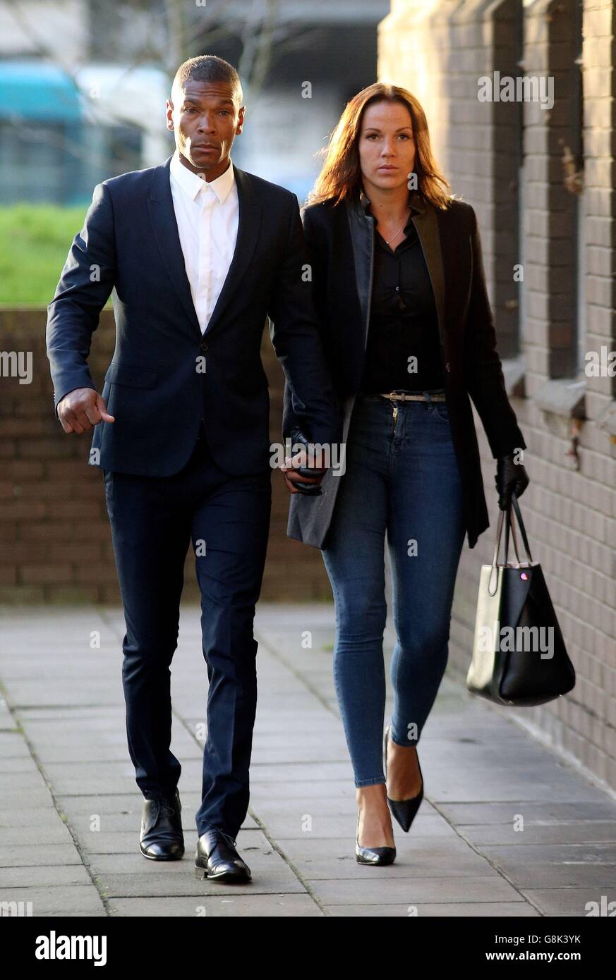 Former Premier League footballer Marcus Bent arrives with his partner (name not known) at ...