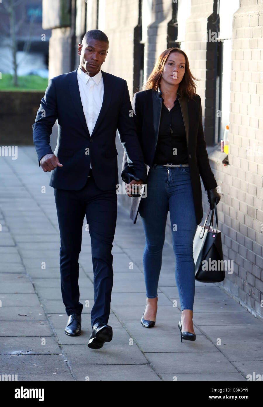 Former Premier League footballer Marcus Bent arrives with his partner ...