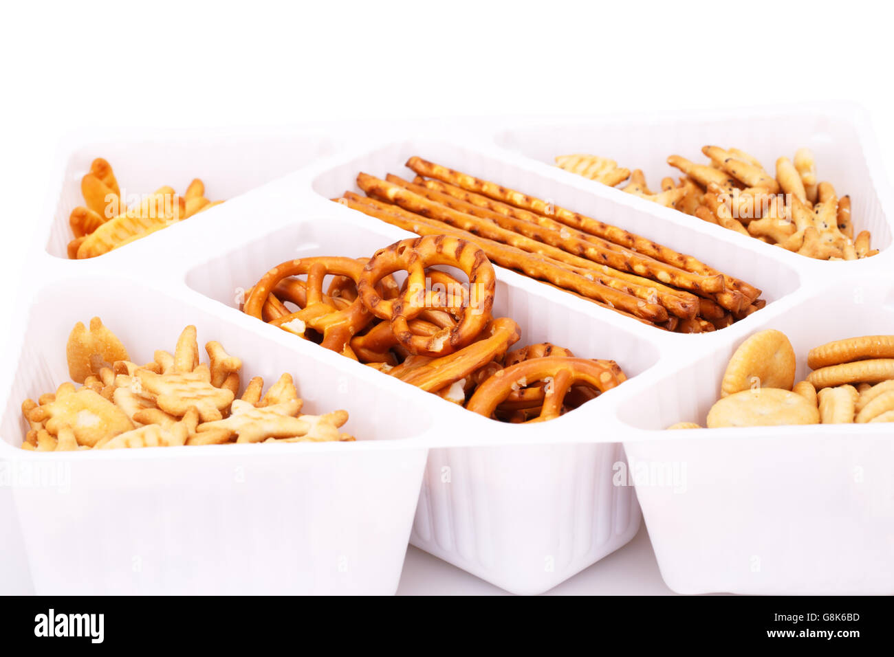 Different salted crackers in box on white background Stock Photo - Alamy