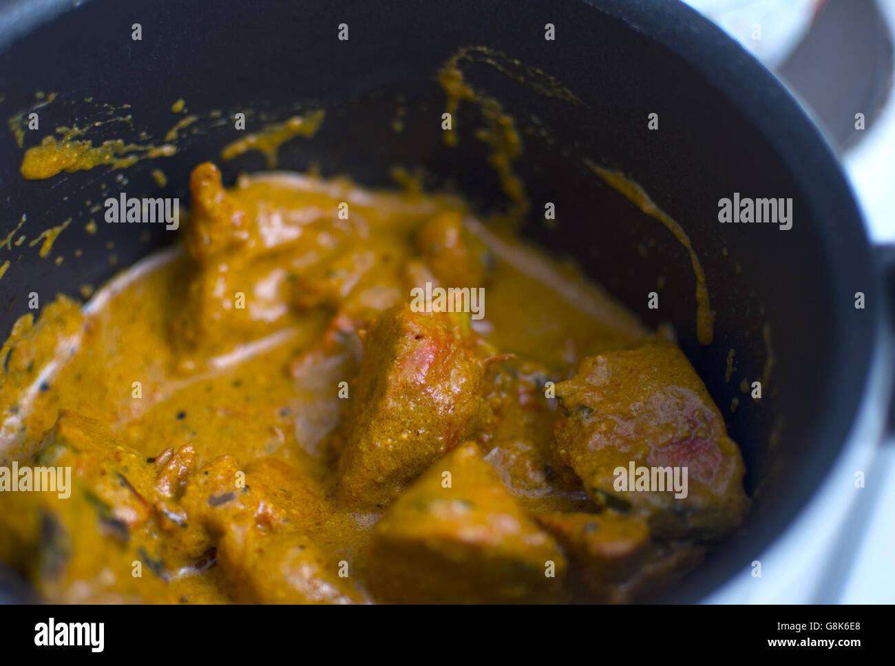 An Indian chicken curry in a cooking pot Stock Photo - Alamy