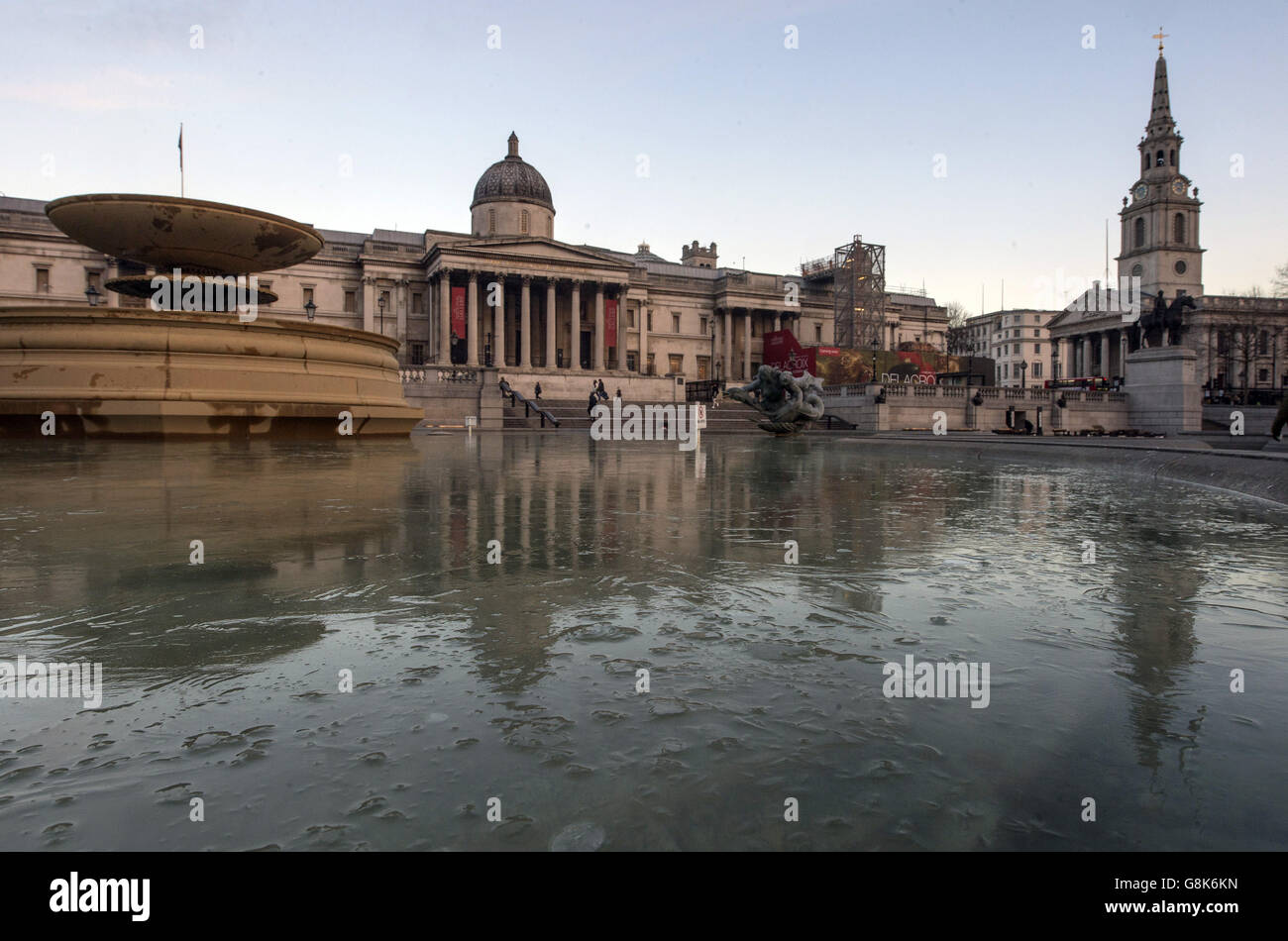 A thin layer of ice covers the fountains in Trafalgar Square, London ...