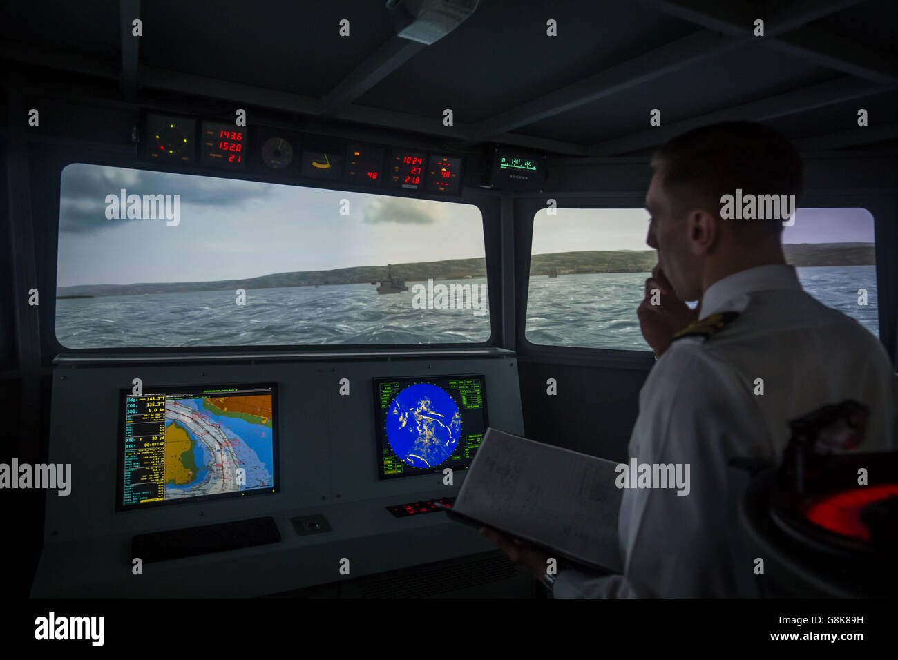 A member of the Royal Navy in bridge simulator for small ships and ...