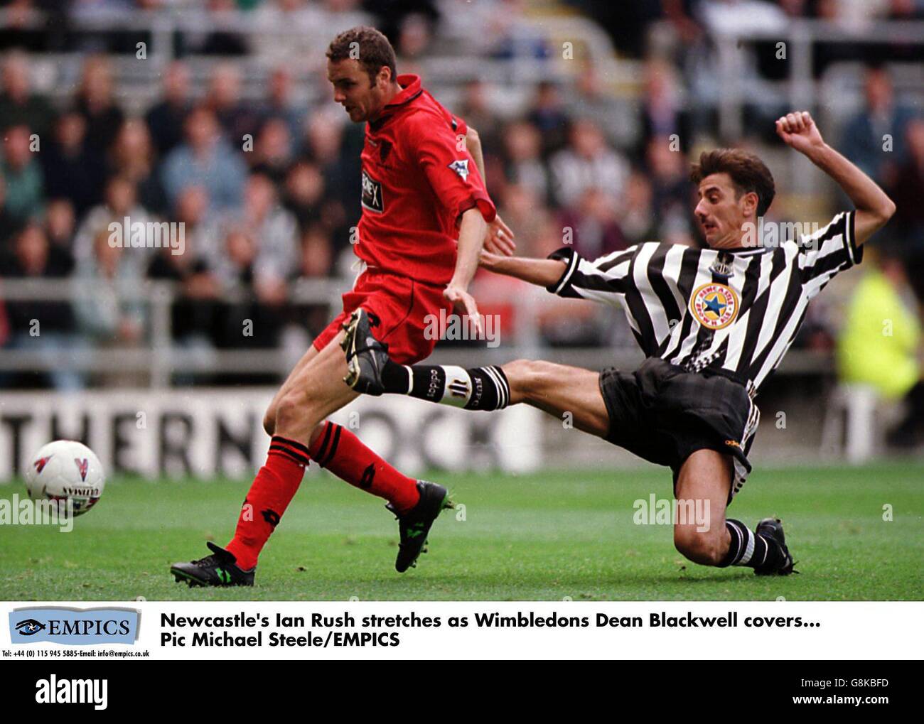 Newcastle United's Ian Rush (right) stretches as Wimbledon's Dean ...