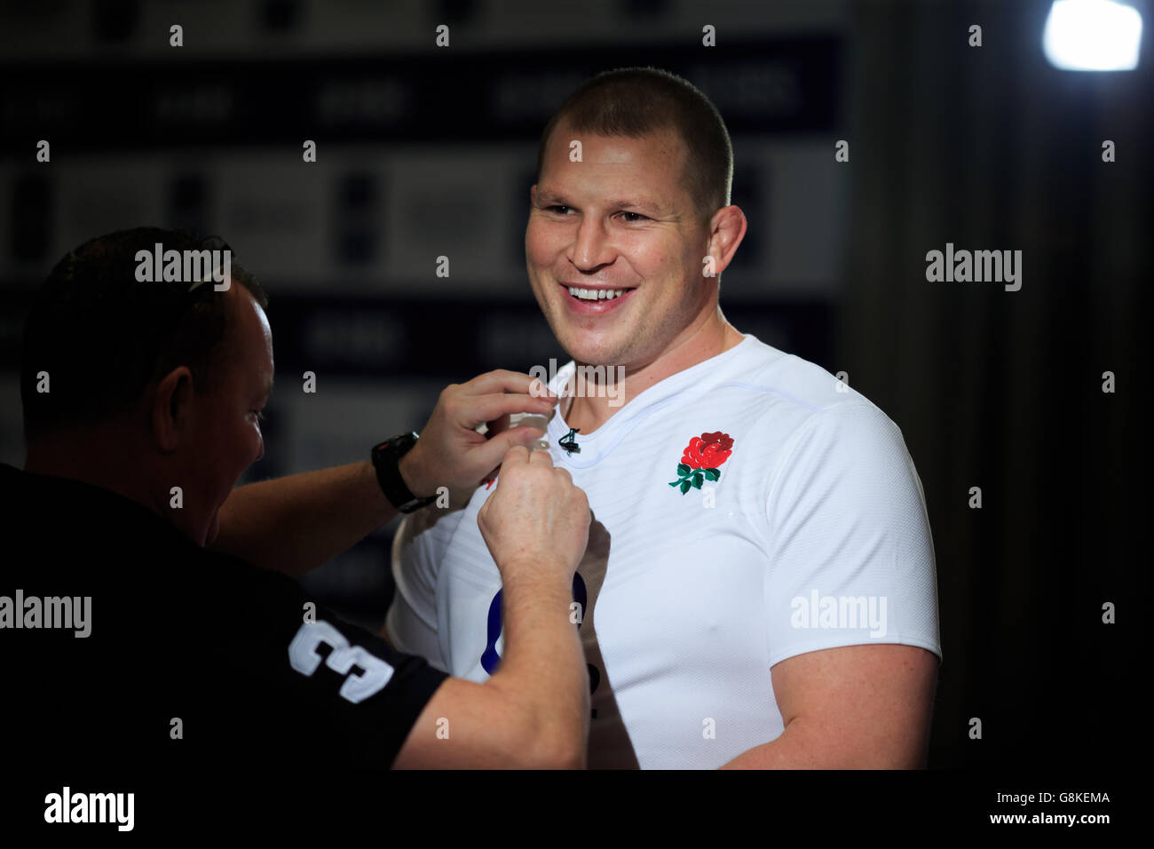 England captain Dylan Hartley laughs as a microphone is attached to him ...