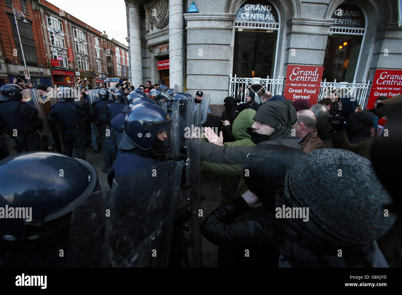 Members of the Garda Public Order Unit confront anti-racism protesters ...