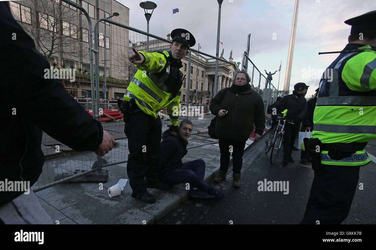 A man is detained as members of the Garda Public Order Unit clash with ...