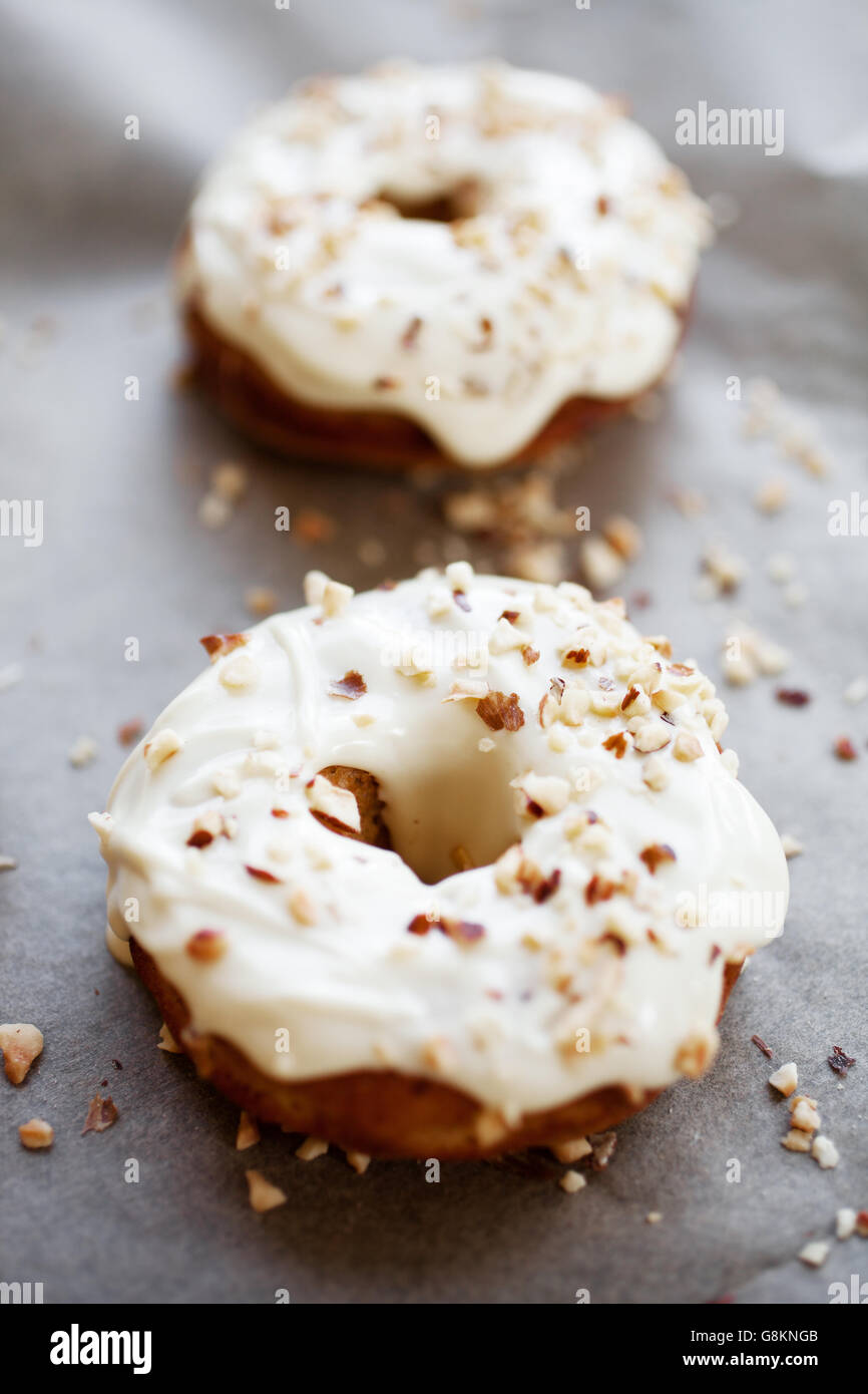 Homemade donuts with white chocolate and hazelnut topping Stock Photo ...