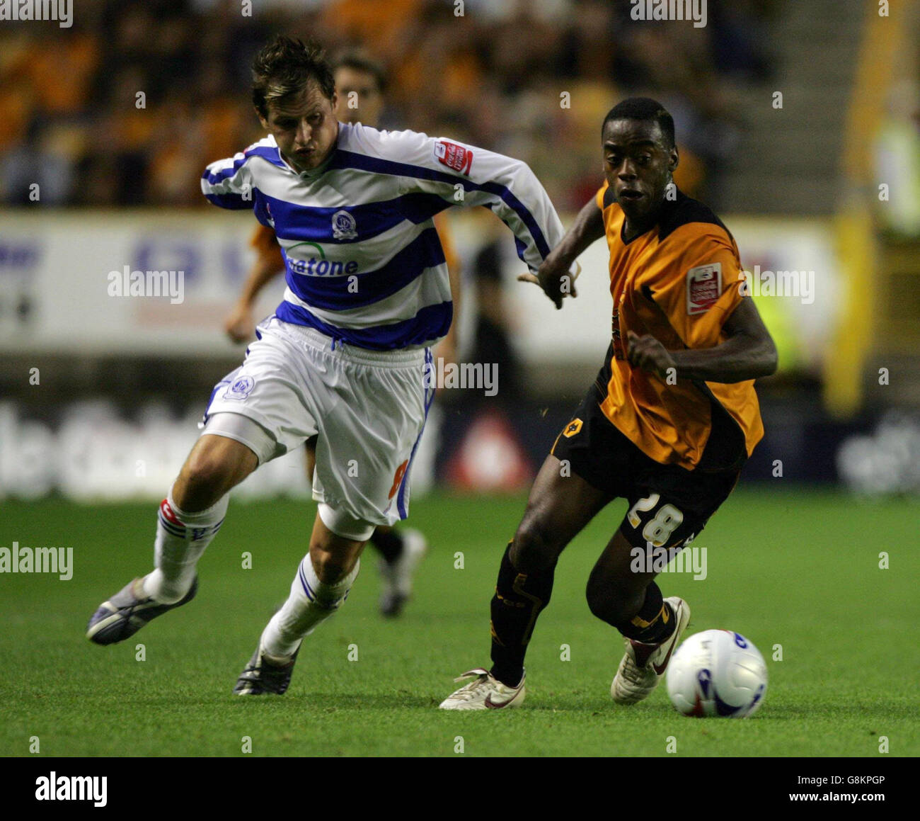 Wolverhampton Wanderers' Rohan Ricketts (R) holds off QPR's Marc ...