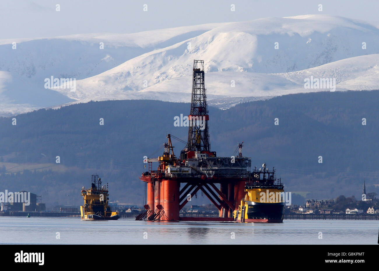 The oil platform Stena Spey is moved with tug boats amongst other rigs ...