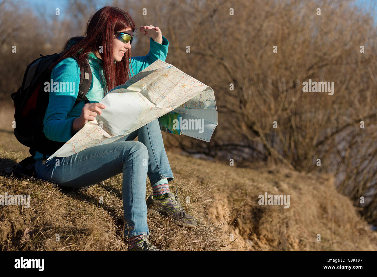 Woman with map Stock Photo - Alamy