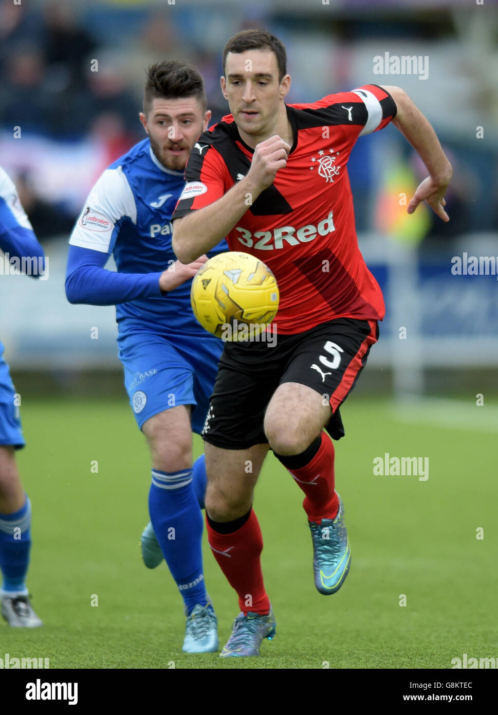 Queen of the South's Lewis Kidd and Rangers' Lee Wallace (right) battle ...