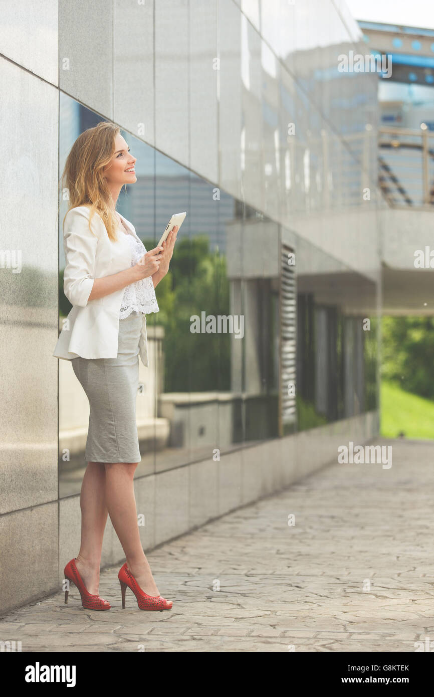 Beautiful woman with tab Stock Photo - Alamy