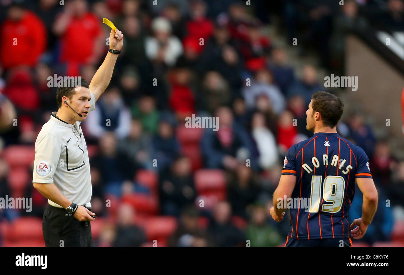 Referee dean whitestone shows blackpools david norris the yellow card ...