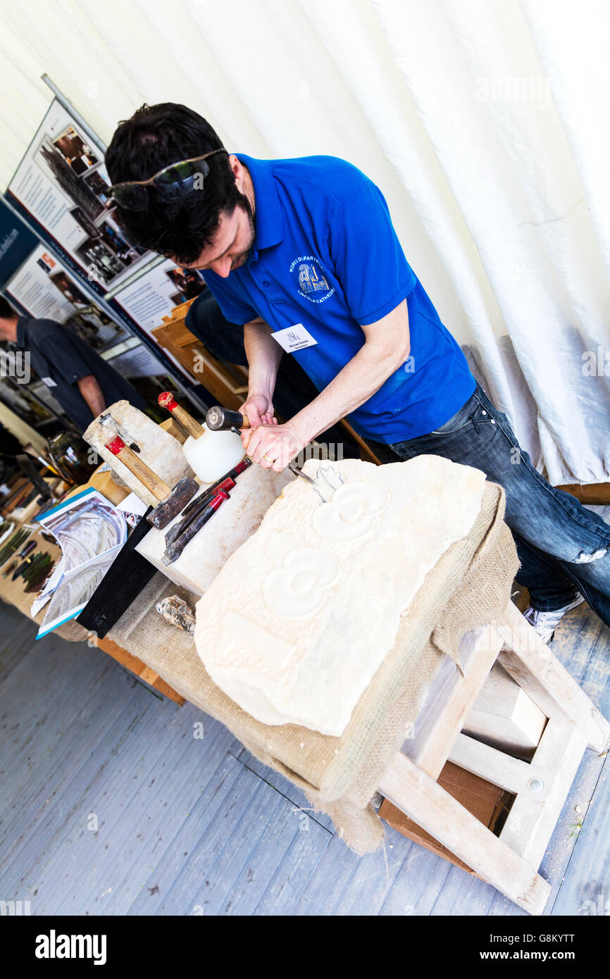Stonemason carving stone stone mason working using hammer and chisel to ...