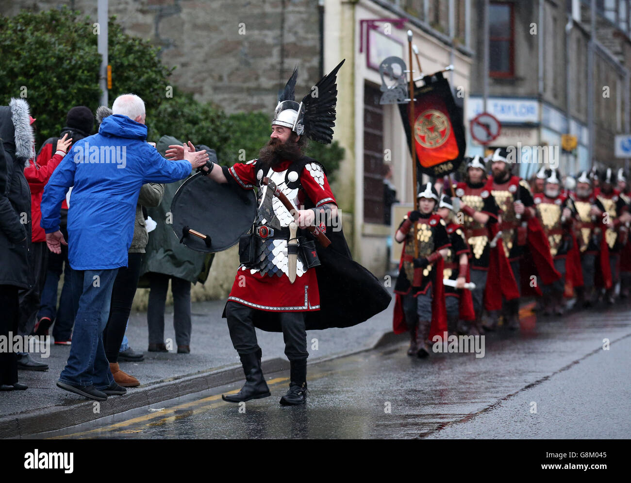 Guizer Jarl Mark Evans leads members of the Jarl Squad dressed in ...