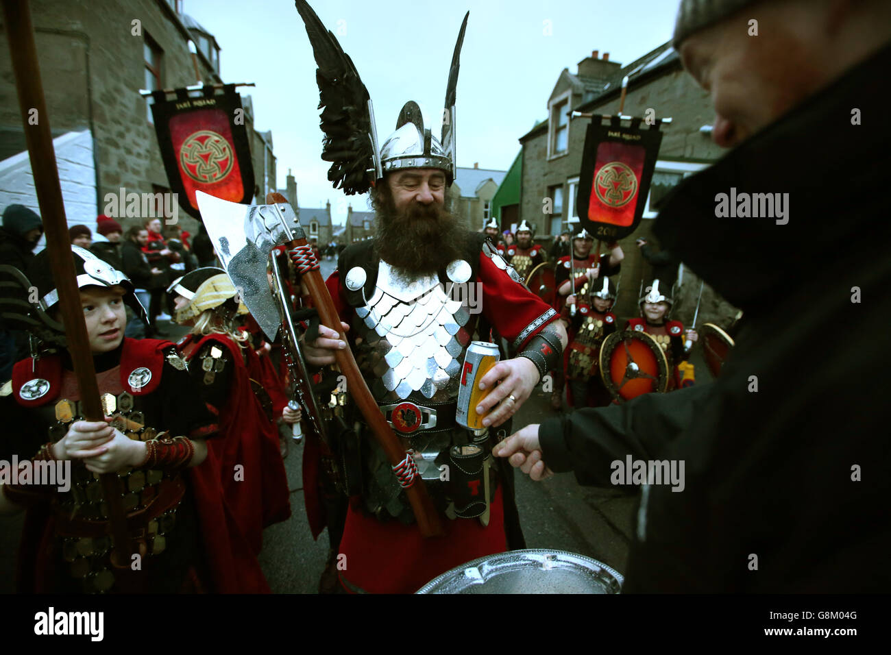 Guizer Jarl Mark Evans leads members of the Jarl Squad dressed in ...