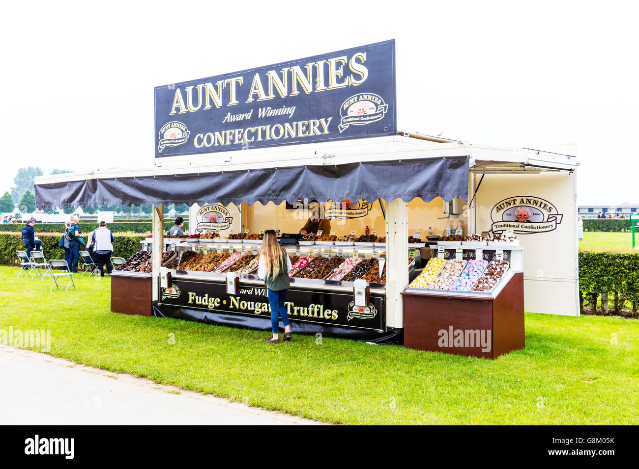 Confectionery stand stall selling sweets outside at trade fair candy ...