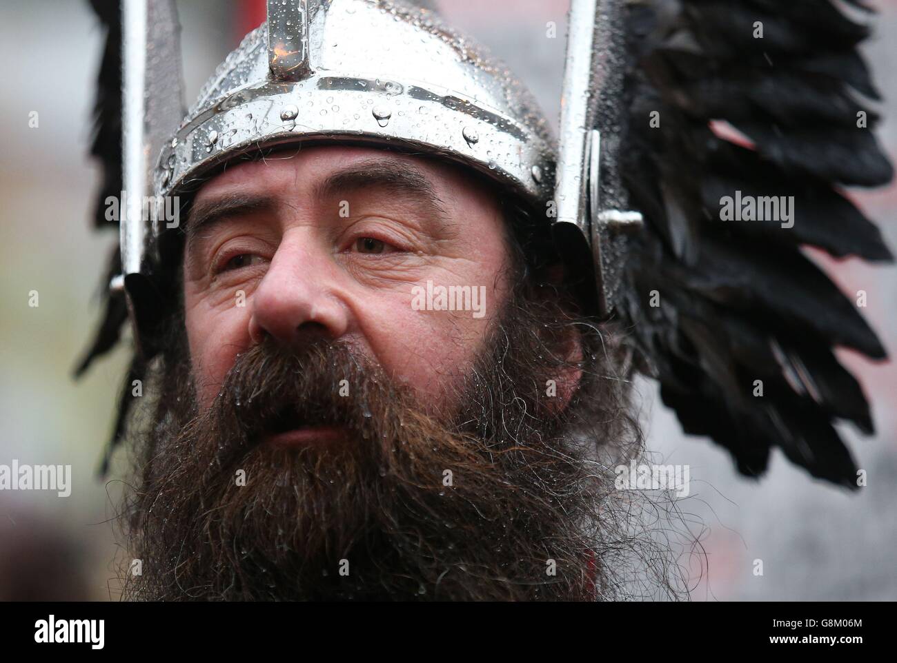 Guizer Jarl Mark Evans leads members of the Jarl Squad dressed in ...