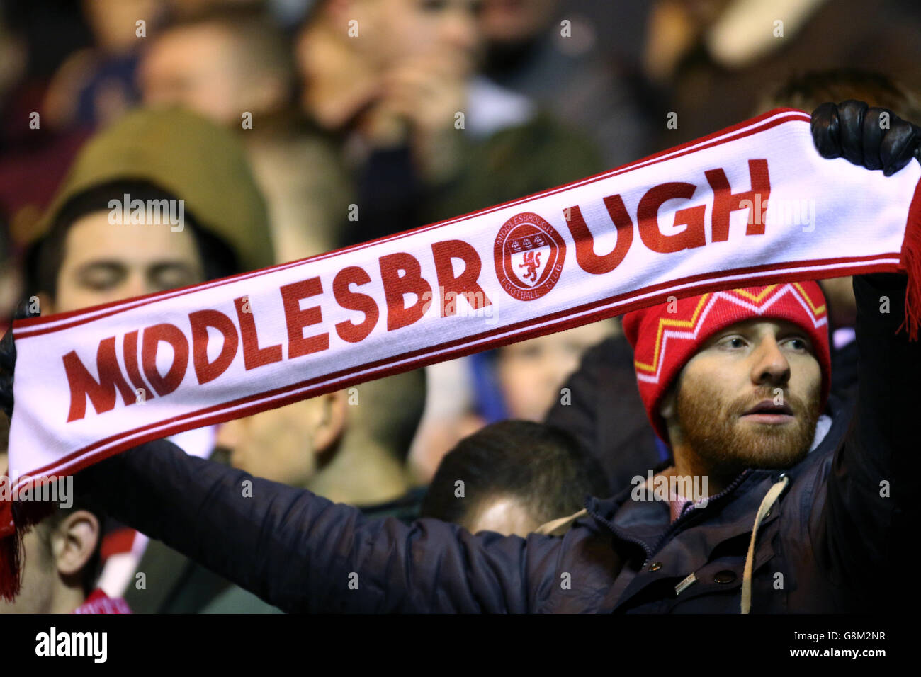 Football supporter holds up scarf hi-res stock photography and images ...