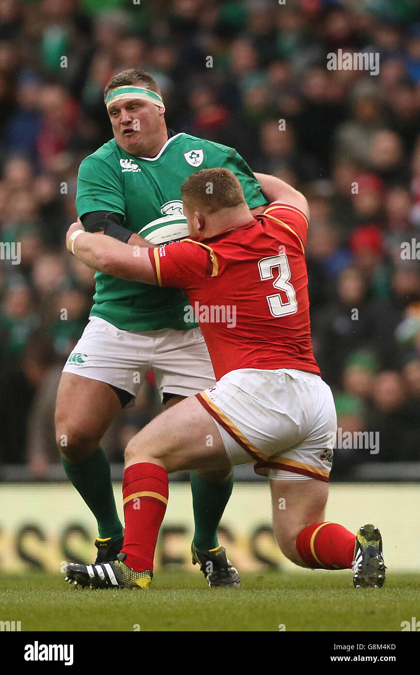 Ireland's Nathan White (left) is tackle by Wales' Samson Lee during the ...