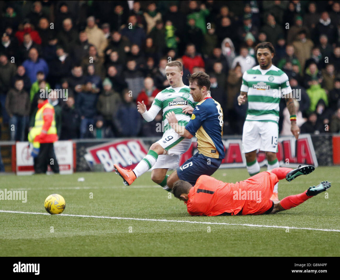 Celtic's Leigh Griffiths (left) battles for the ball with East Kilbride ...