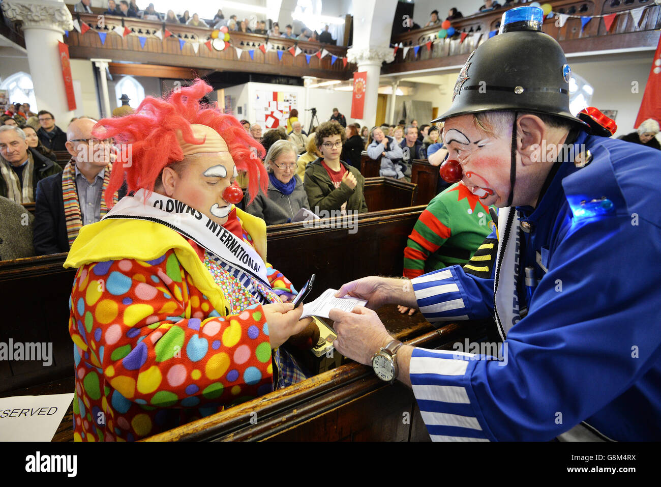A crowd of clowns fill the front pews at All Saints in Hackney, London ...
