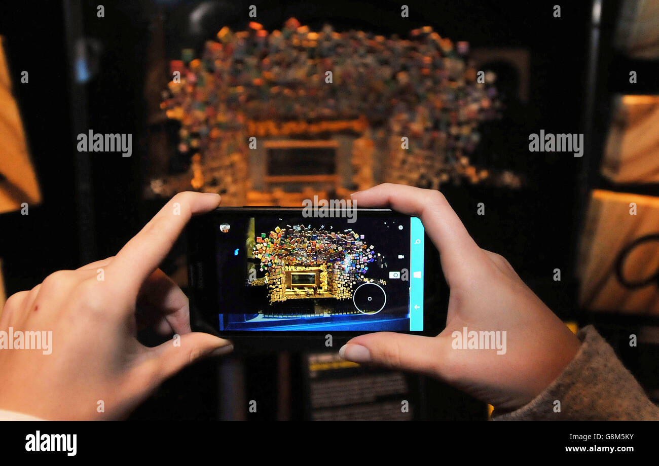 A visitor photographs Rob Howell's set model box for Matilda The ...