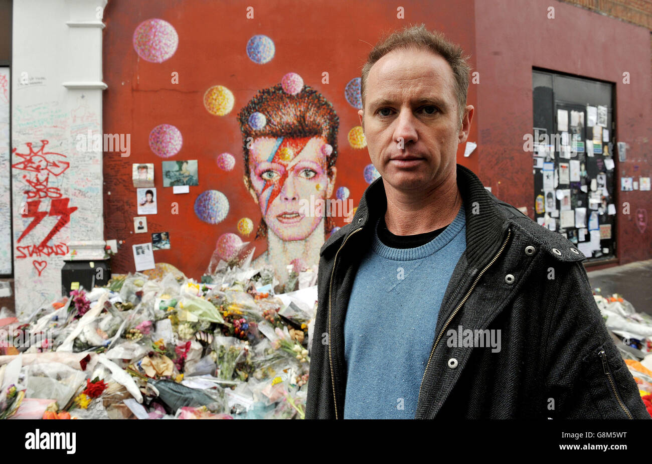 Artist Jimmy C, stands in front of his David Bowie mural artwork on the ...