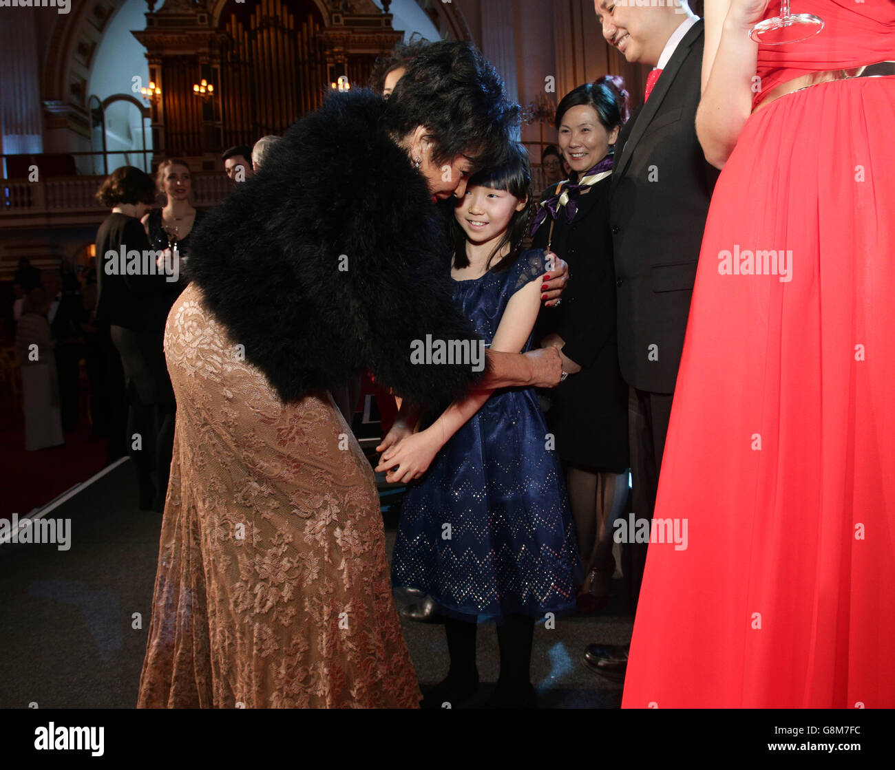 Her parents chui au and nicholas kwok hi-res stock photography and ...