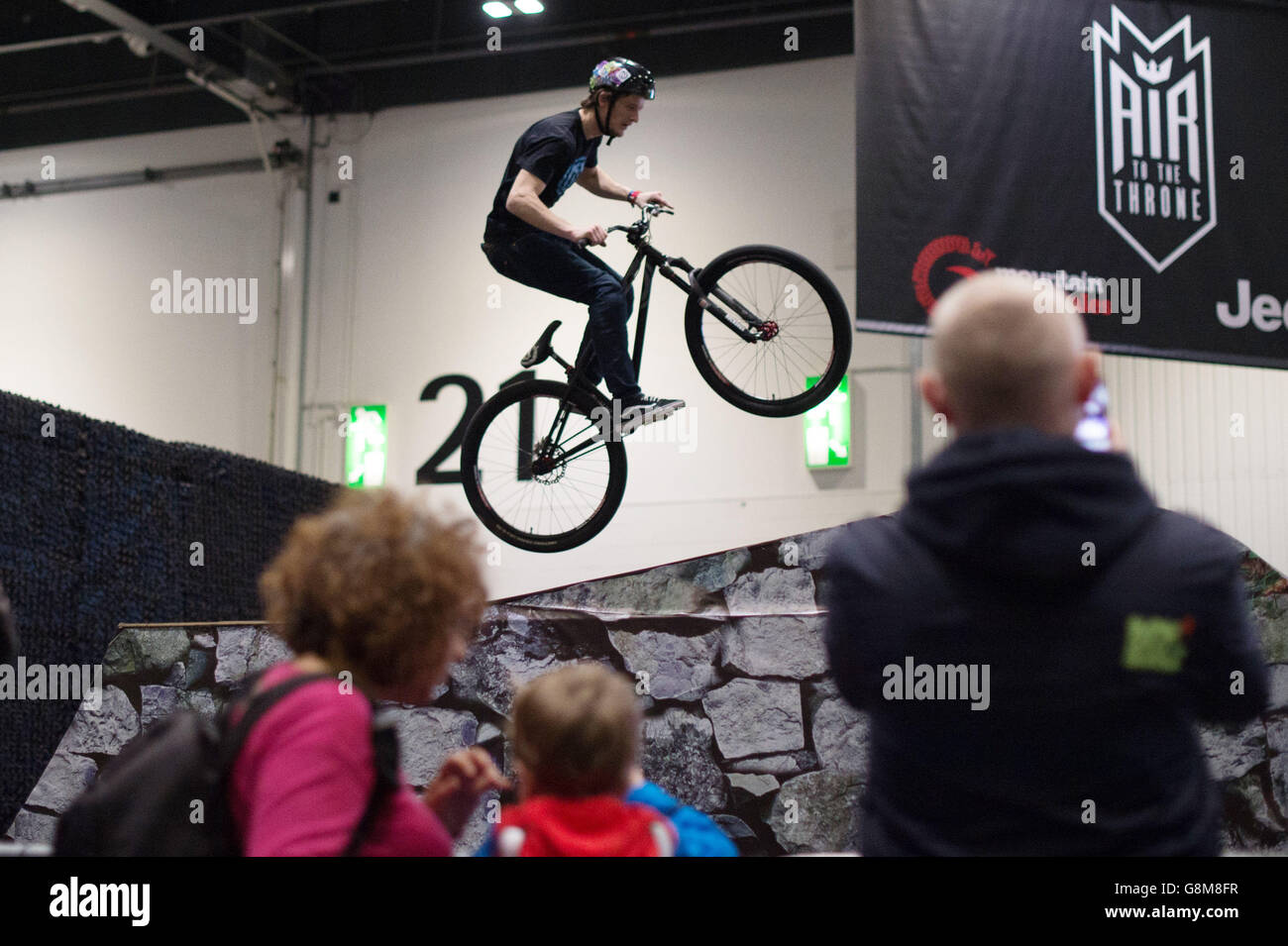A BMX rider performs stunts at the London Bike Show at the Excel centre ...