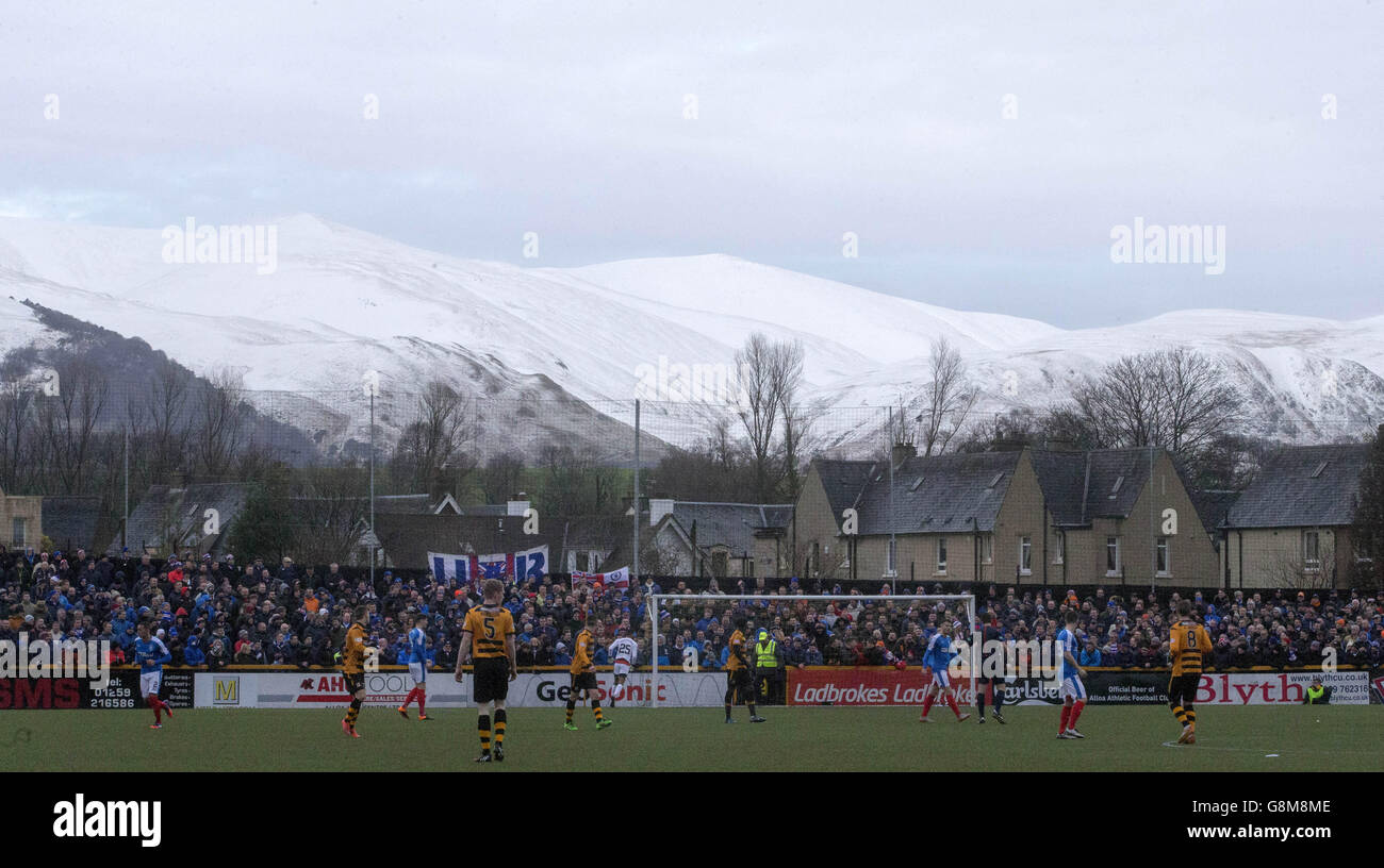 A view of snow capped hills in the distance as the match plays during ...
