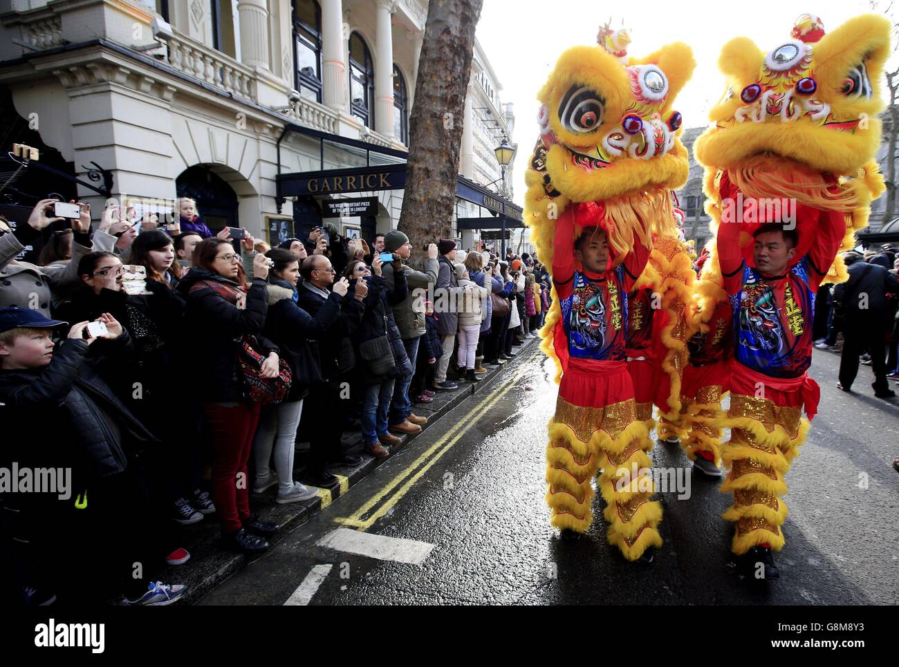 Lion dancers take part in the Chinese New Year parade along Charing ...