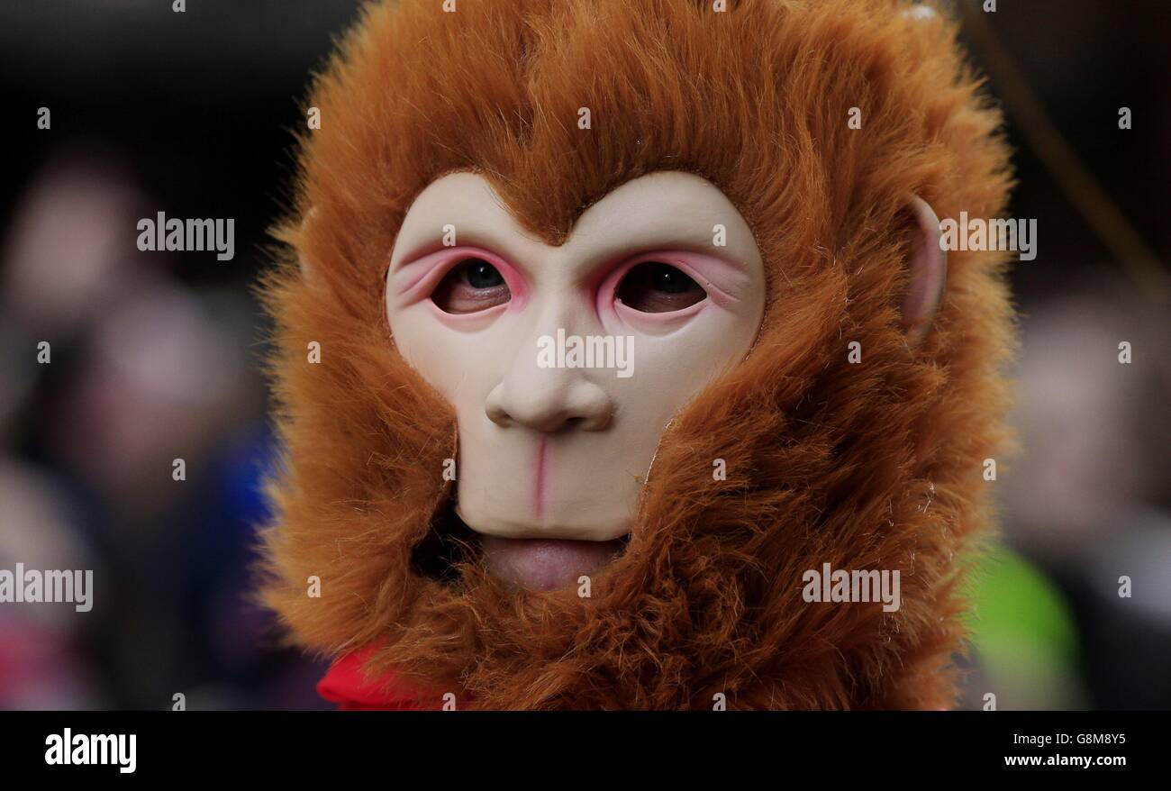 A performer dressed as a monkey takes part in the Chinese New Year ...