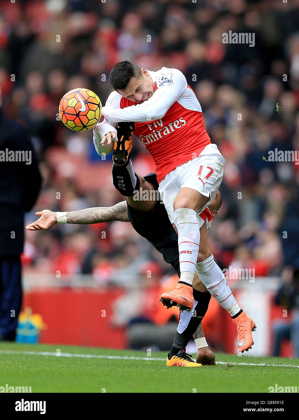 Arsenal's Alexis Sanchez and Leicester City's Danny Simpson battle for ...