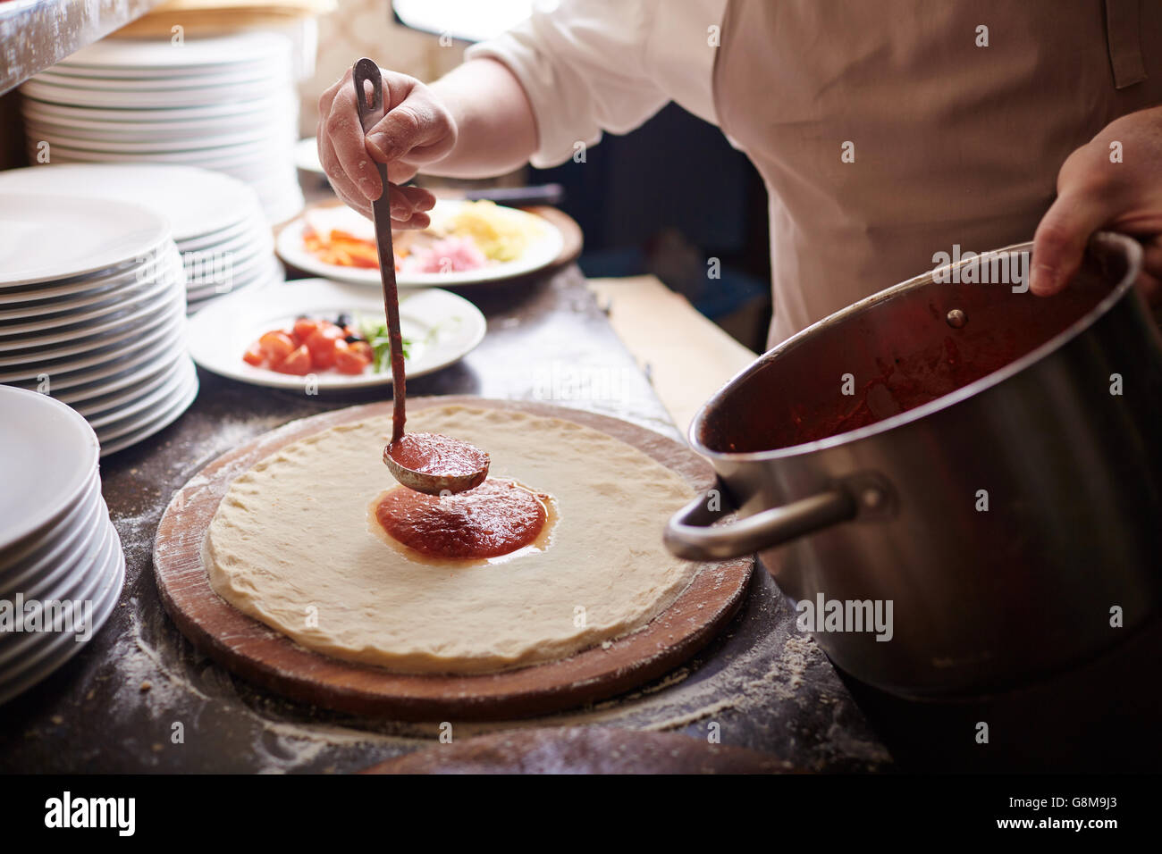 Chef rolling pizza dough hi-res stock photography and images - Alamy
