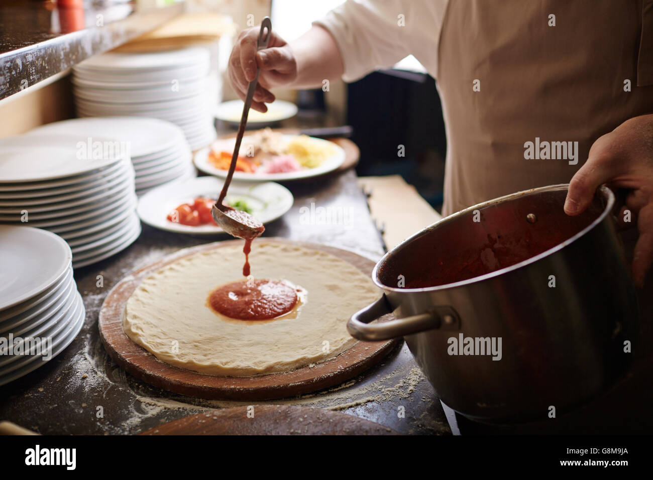 Chef making pizza Stock Photo - Alamy