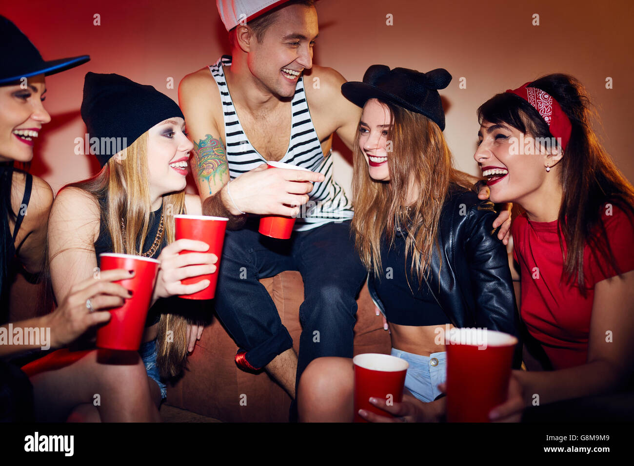 Talking in club Stock Photo - Alamy