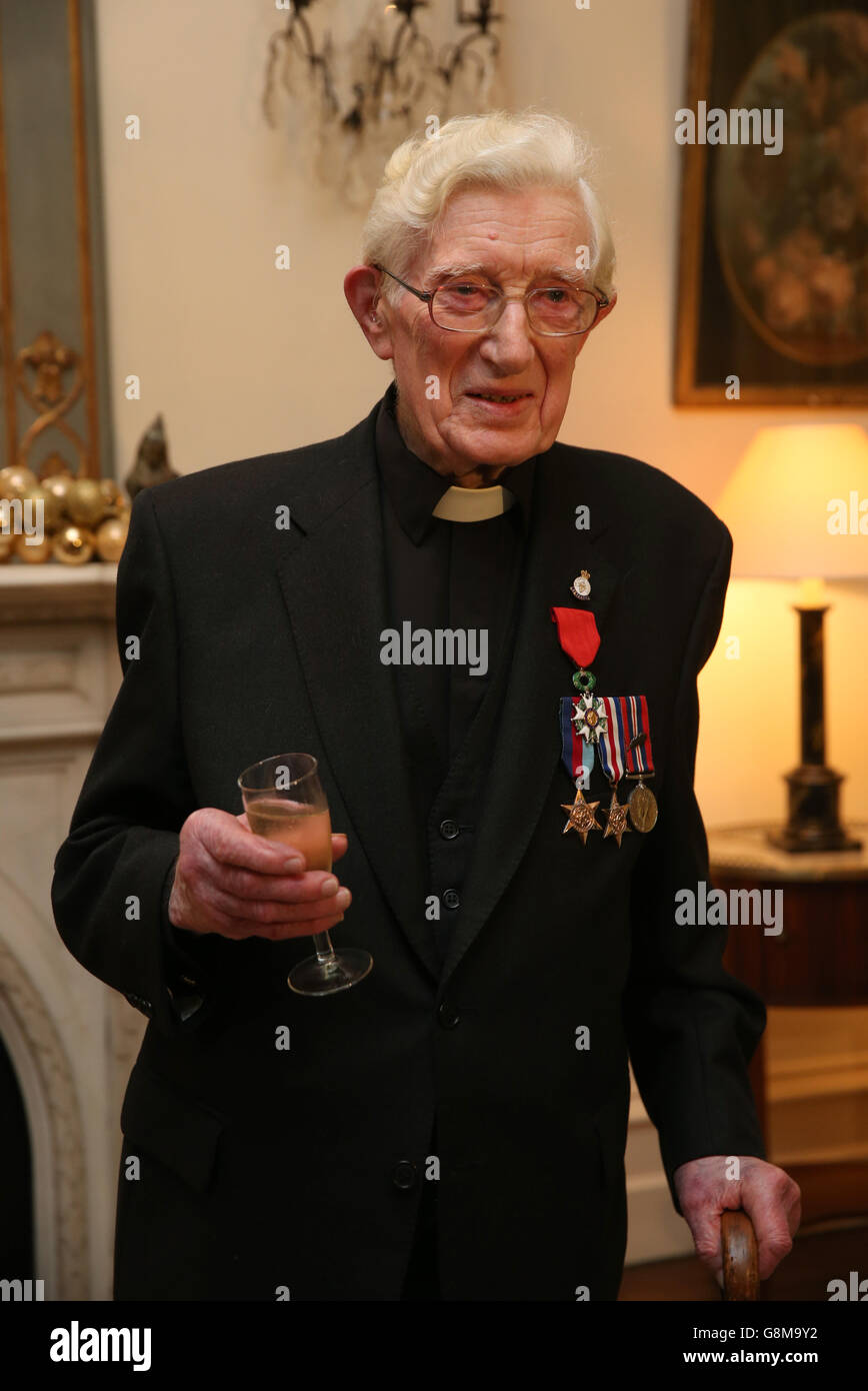 D-Day veteran Canon Robert William Marsden raises a glass after he was ...