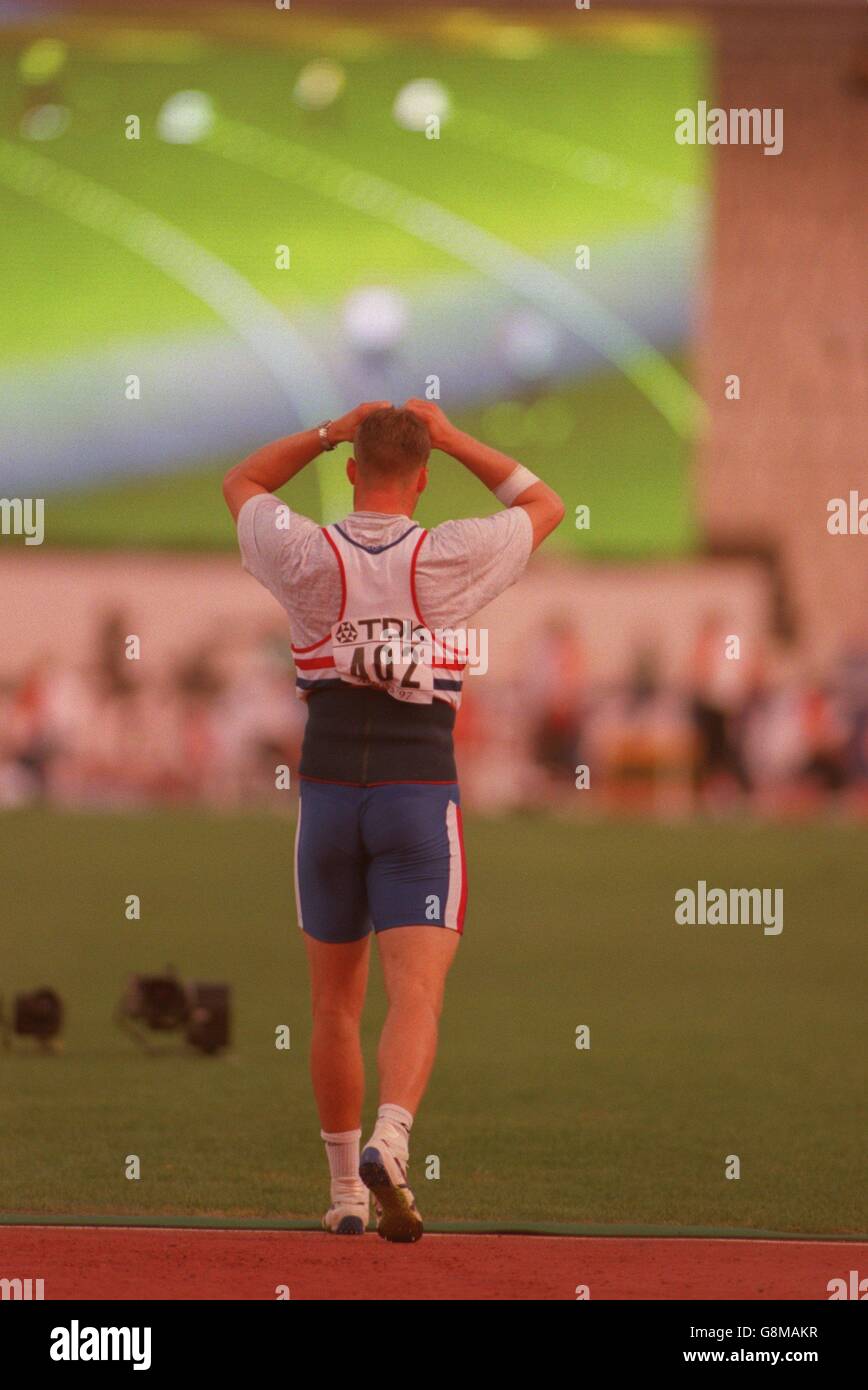 Great Britain's Mick Hill holds his head after failing to take the ...