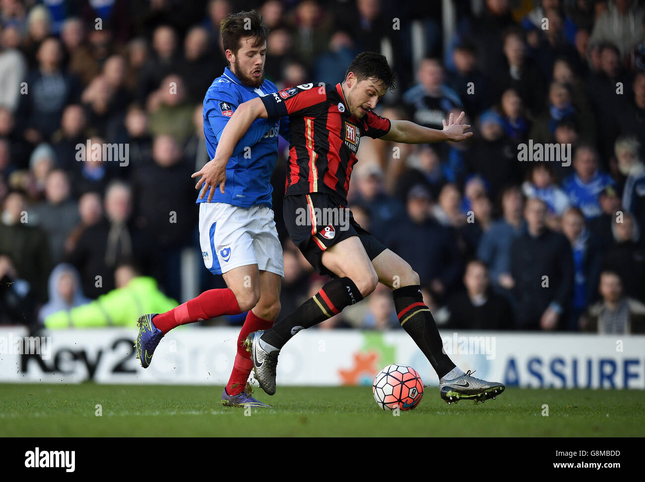 Portsmouth's Marc McNulty (left) and AFC Bournemouth's Tommy Elphick ...