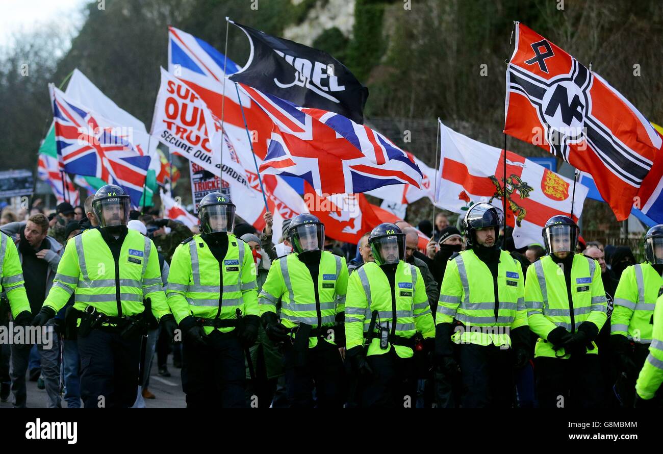 Police officers escort right wing protestors on a march to the Port of ...