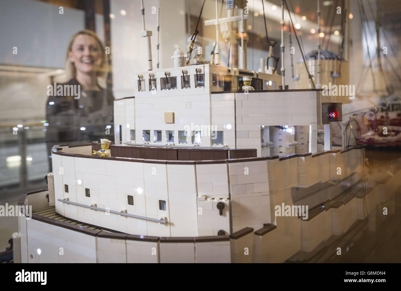 Royal Yacht Britannia employee Emma Aitken looks at a LEGO model of the ...