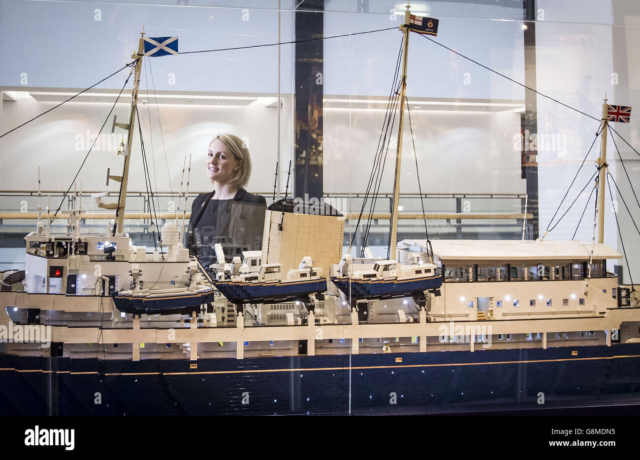 Royal Yacht Britannia employee Emma Aitken looks at a LEGO model of the ...