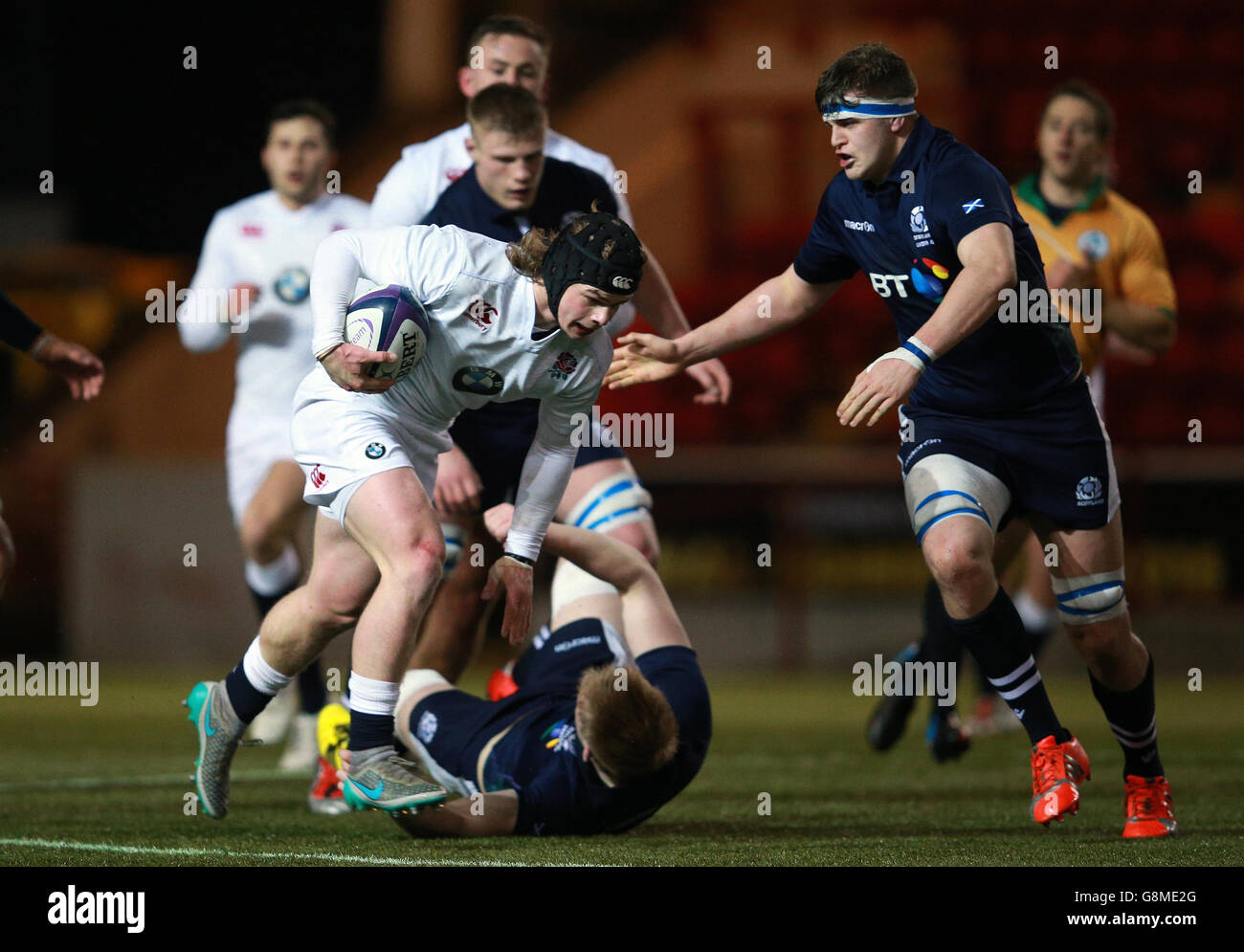 England's Charlie Thacker is tackled by Scotland's Andrew Davidson and ...